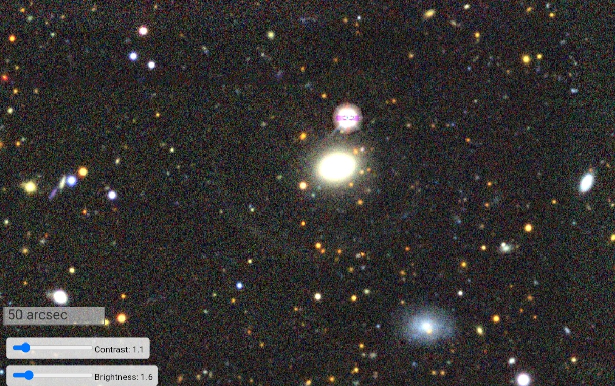 Extremely faint half circle of 'stars' around this galaxy - Interesting ...