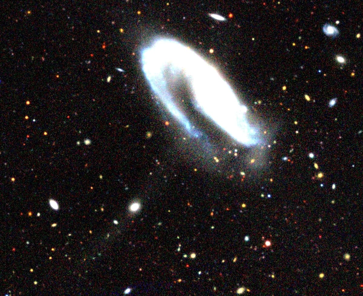 Single 'jet' emerging from distressed looking spiral - Beautiful or ...